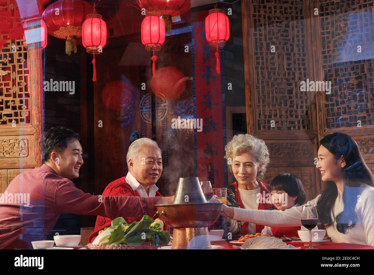 Happy Chinese New Year reunion dinner Oriental families Stock Photo - Alamy