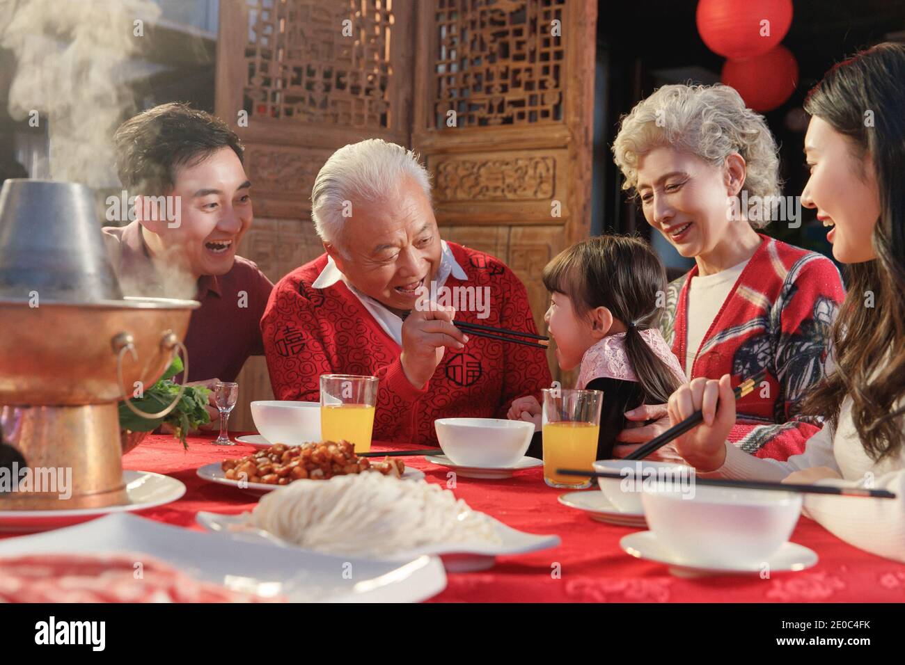 Happy Chinese New Year reunion dinner Oriental families Stock Photo - Alamy