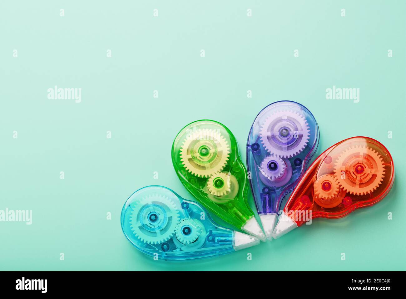 Multi-colored Stationery correction tapes on a blue background. Free ...