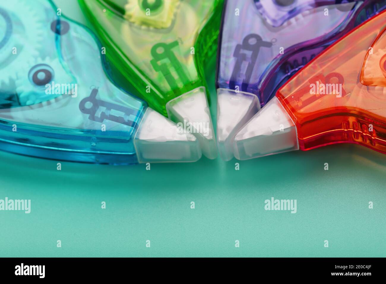 Multi-colored Stationery correction tapes on a blue background. Free ...