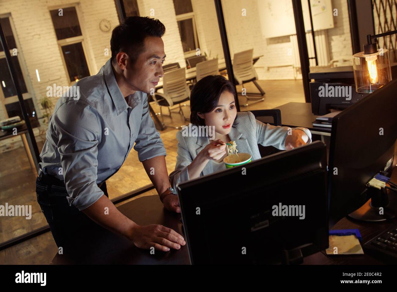 Business people in the office to work overtime Stock Photo - Alamy