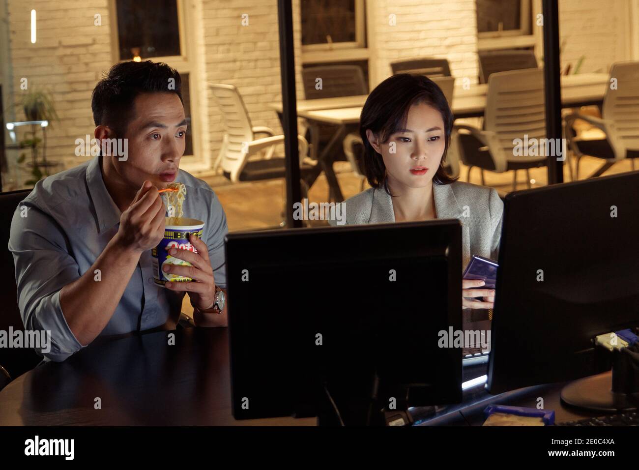 Business people in the office to work overtime Stock Photo - Alamy