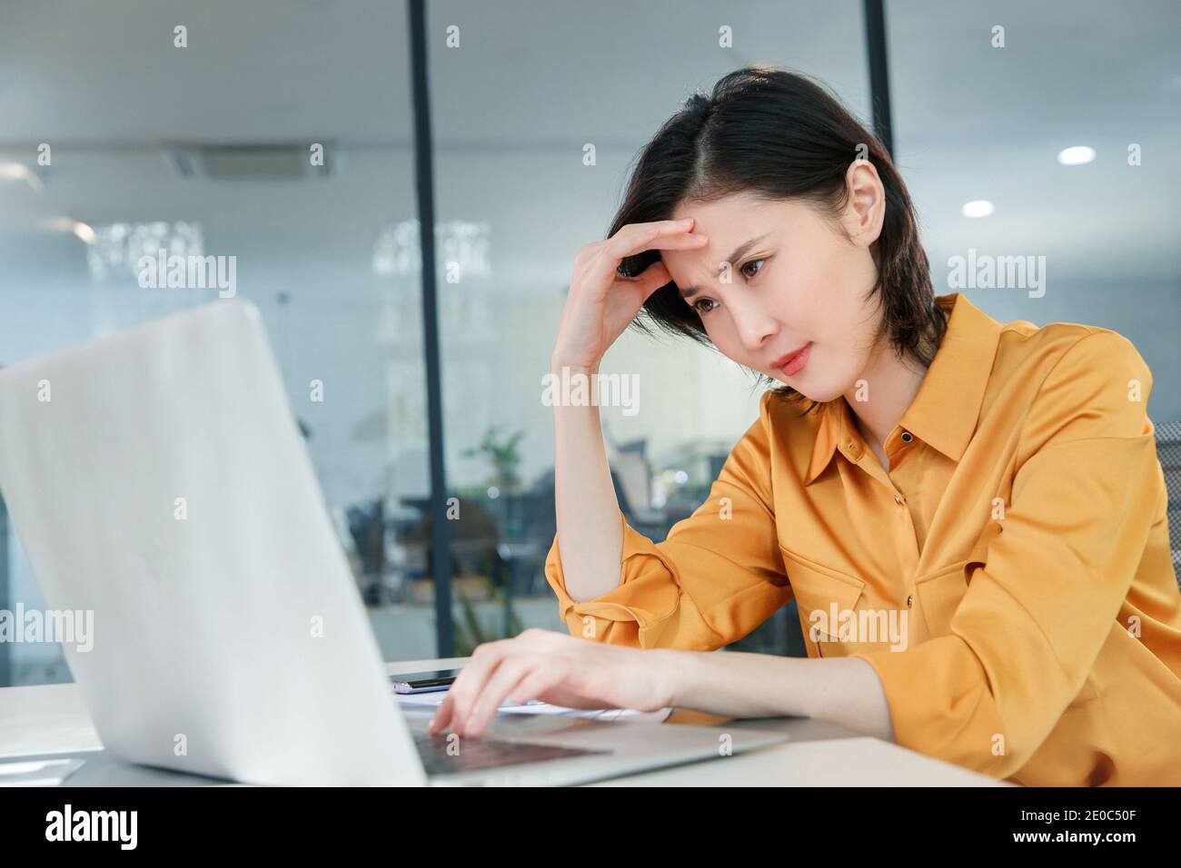 Headache business lady in the office Stock Photo - Alamy