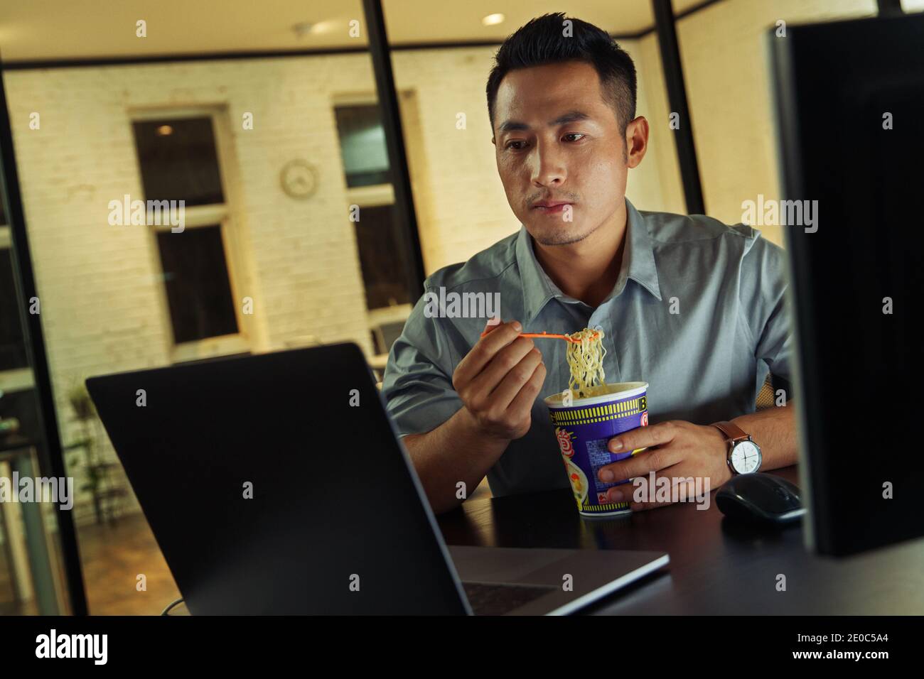Businessman eating noodles asia hi-res stock photography and images - Alamy