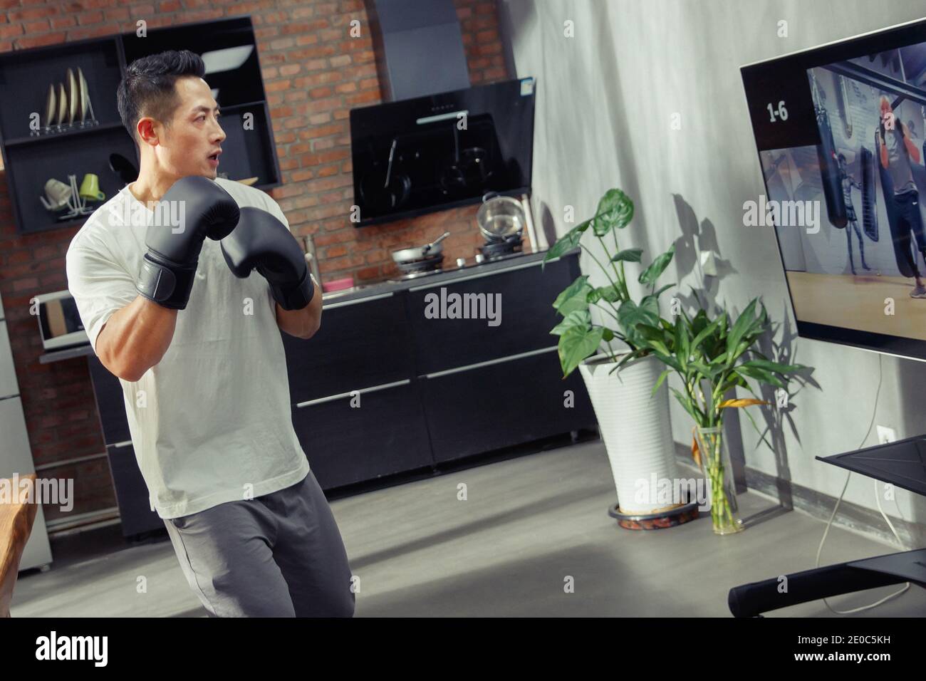 Young men exercise at home Stock Photo - Alamy
