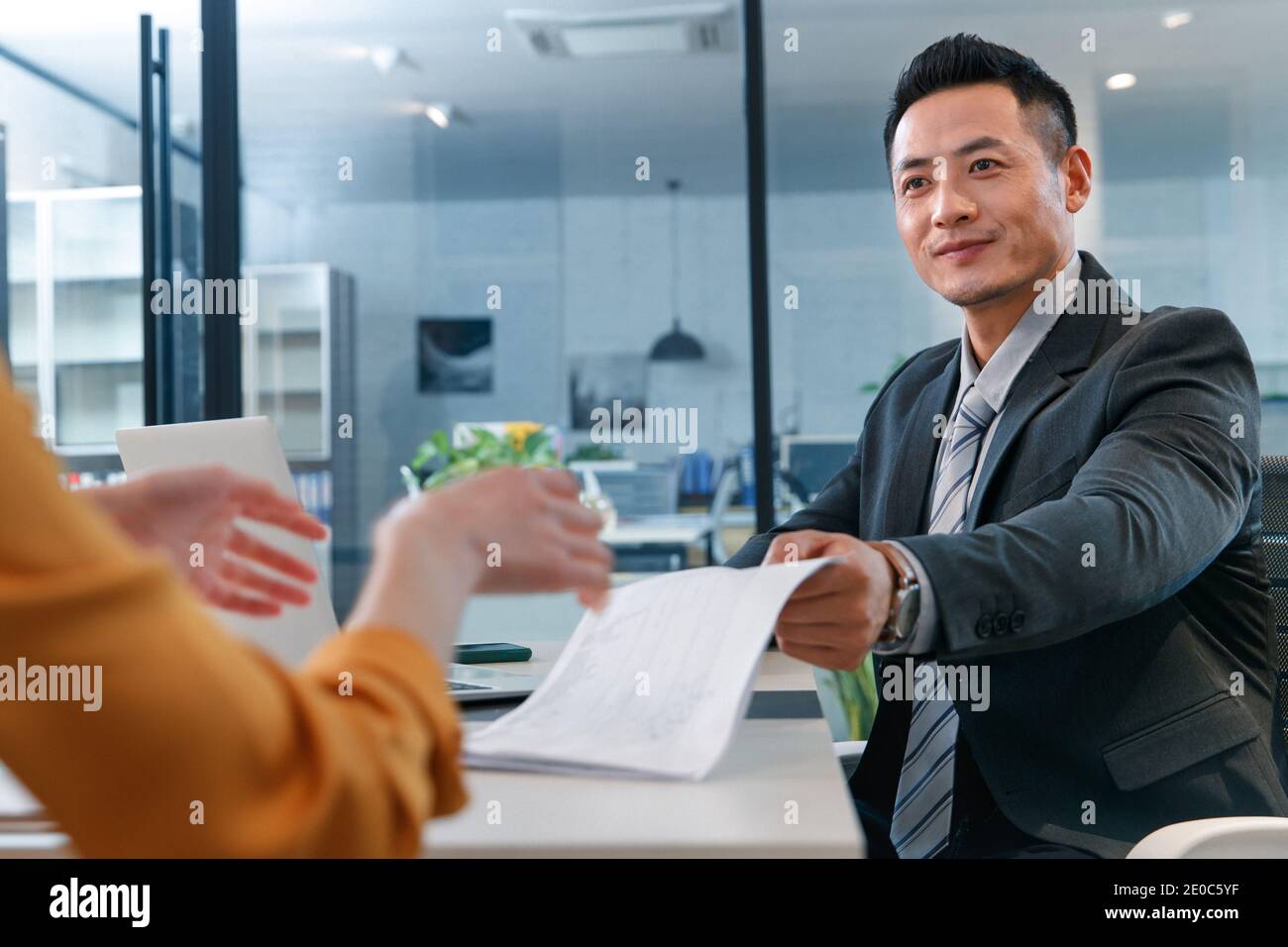 Sales staff with clients Stock Photo - Alamy