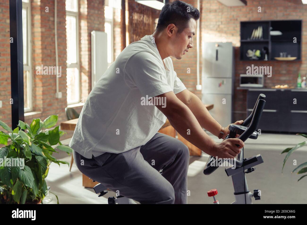 Young men exercise at home Stock Photo - Alamy