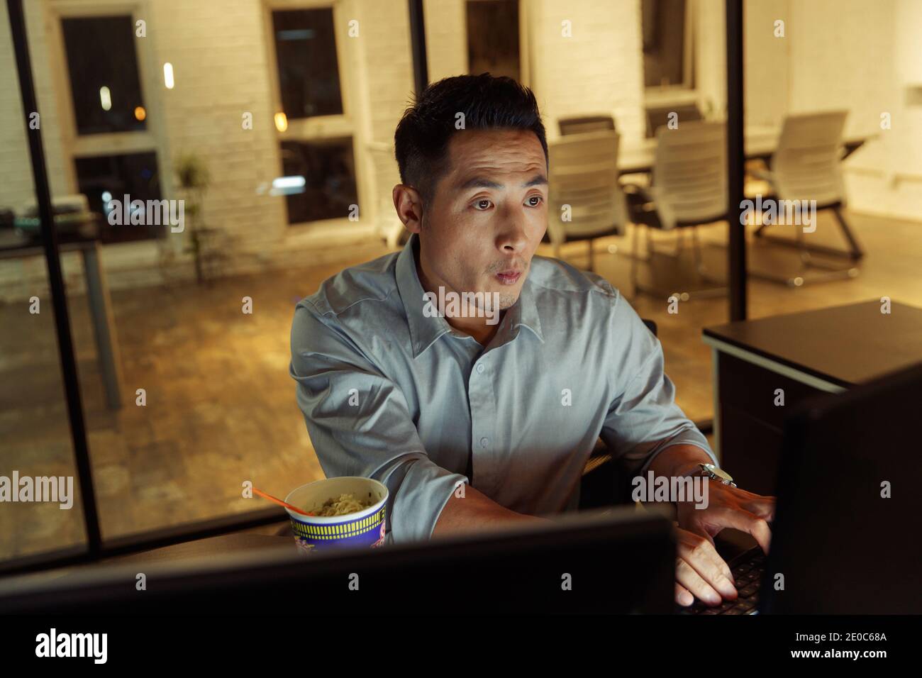 Businessman eating noodles asia hi-res stock photography and images - Alamy
