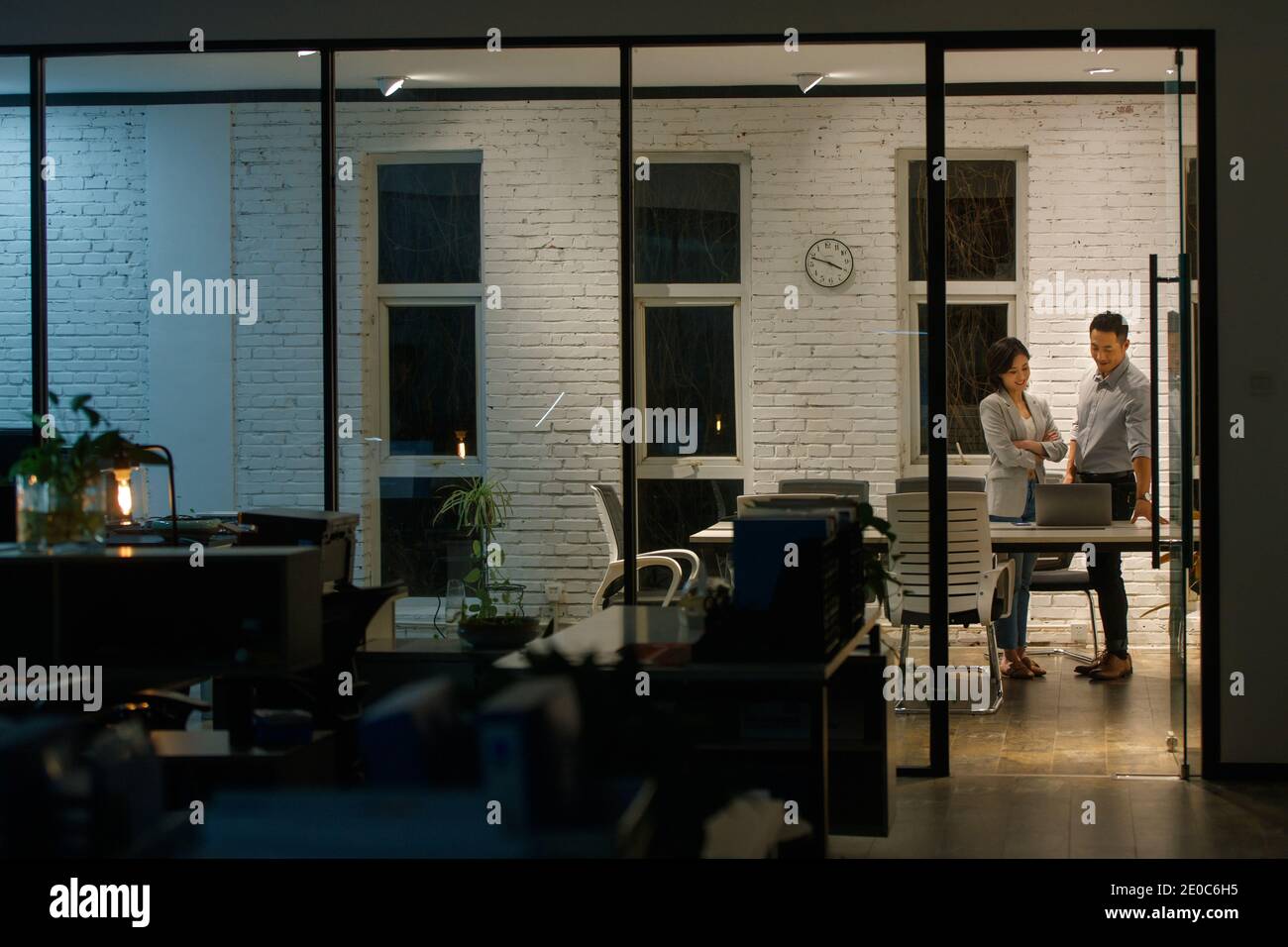 Business people in the office to work overtime Stock Photo - Alamy