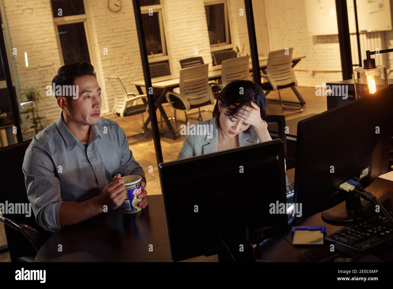 Business people in the office to work overtime Stock Photo - Alamy