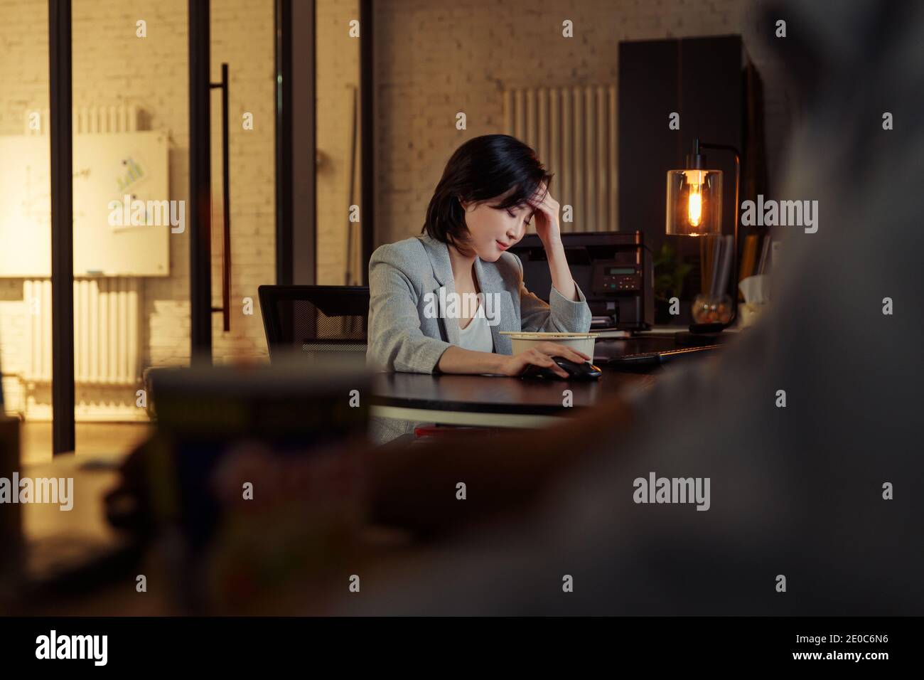 Business people in the office to work overtime Stock Photo - Alamy