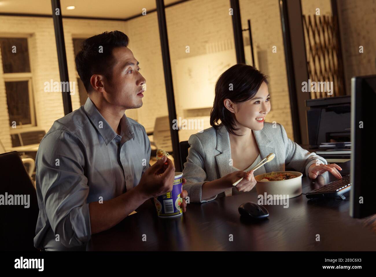 Business people in the office to work overtime Stock Photo - Alamy
