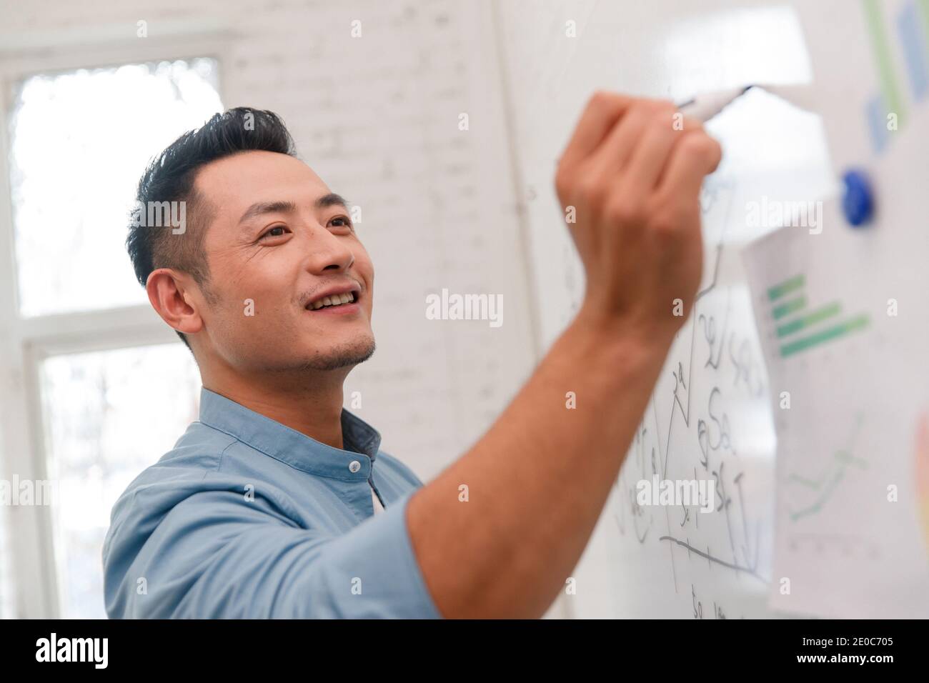 Business men in the office to write on the whiteboard Stock Photo - Alamy