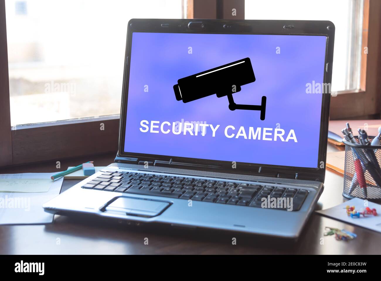 Laptop screen displaying a security camera concept Stock Photo - Alamy