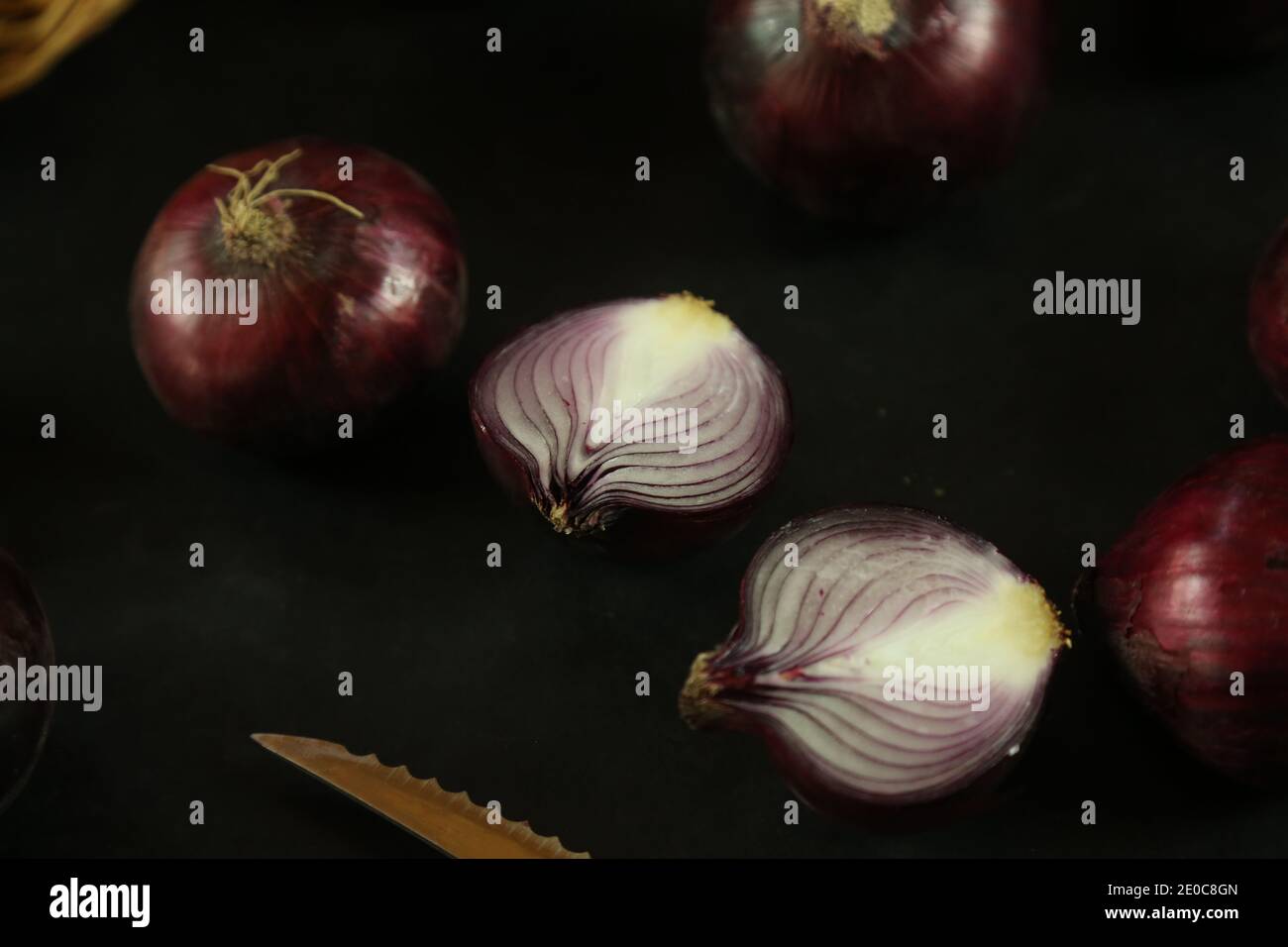 sweet red onions on background Stock Photo - Alamy