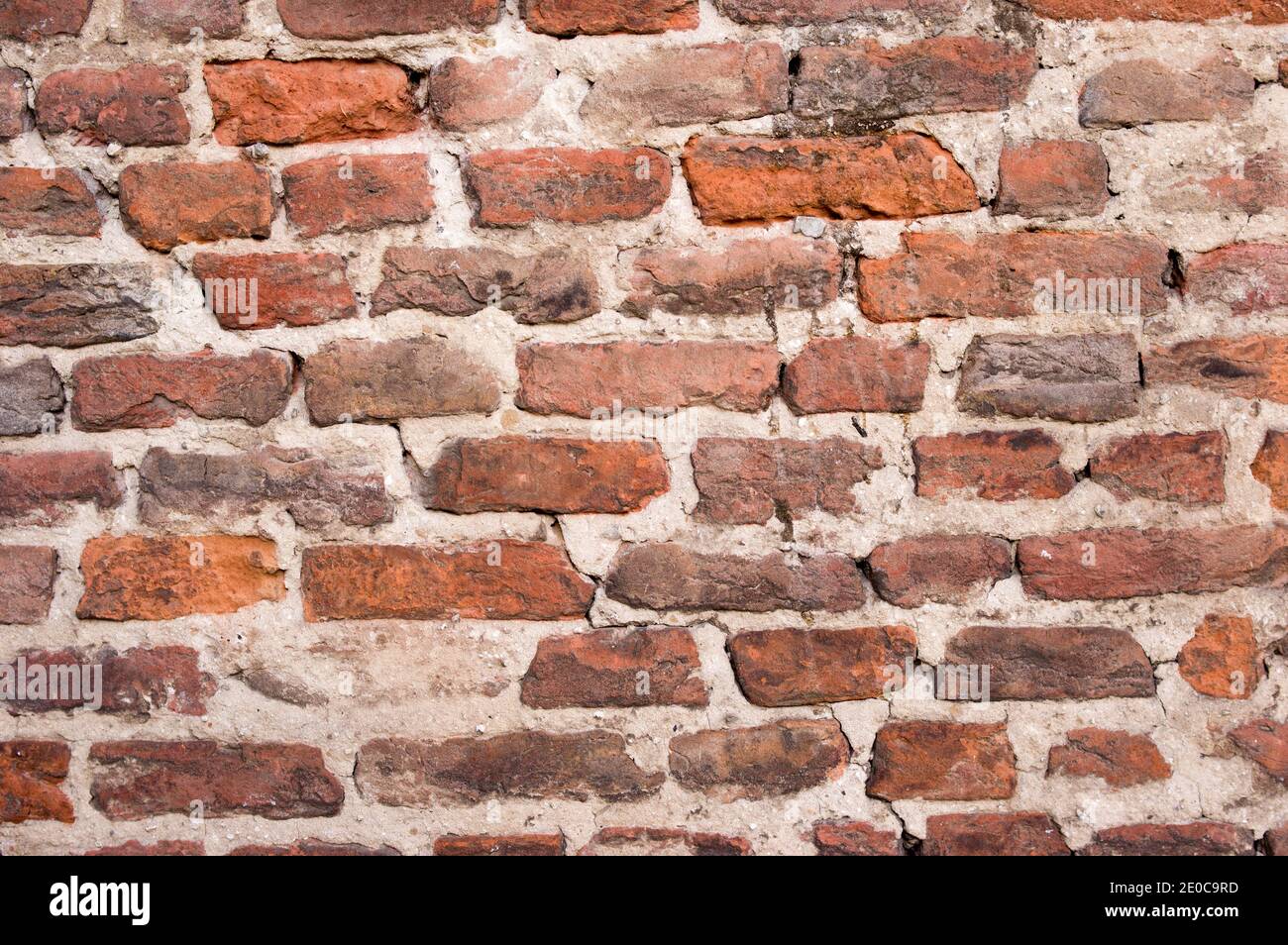 Old stone brick wall with cracks background Stock Photo - Alamy