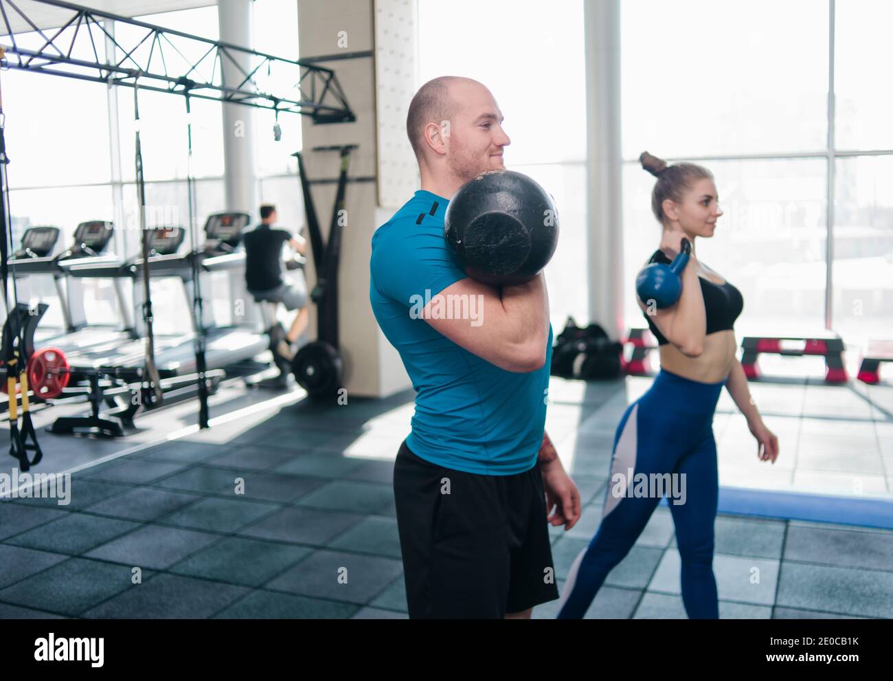 Сouple functional training. Sporty man and fit woman doing exercise ...