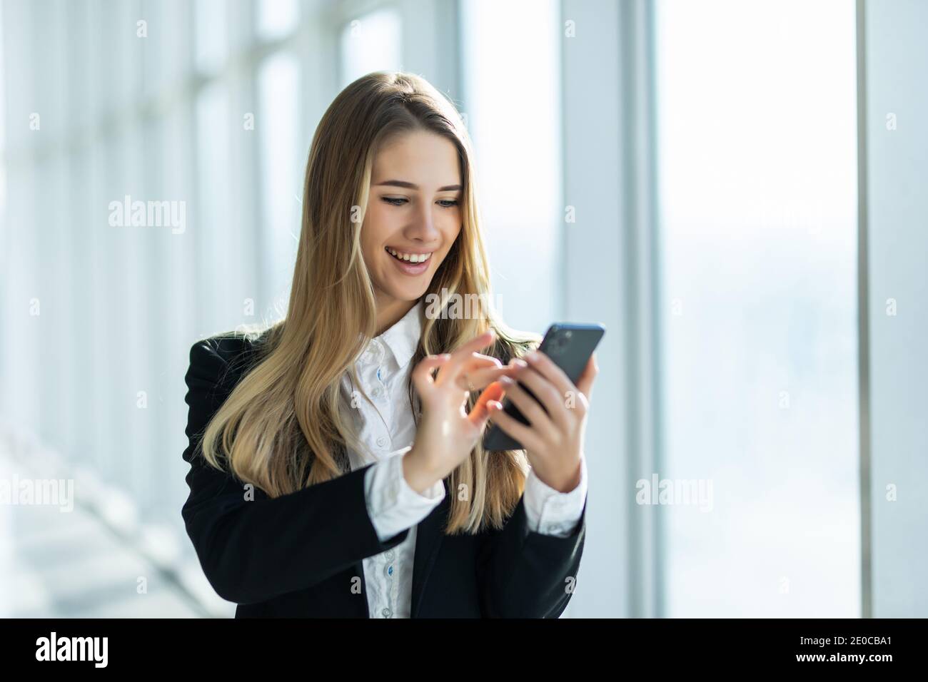 Young business woman use phone for text or surfing in internet in ...