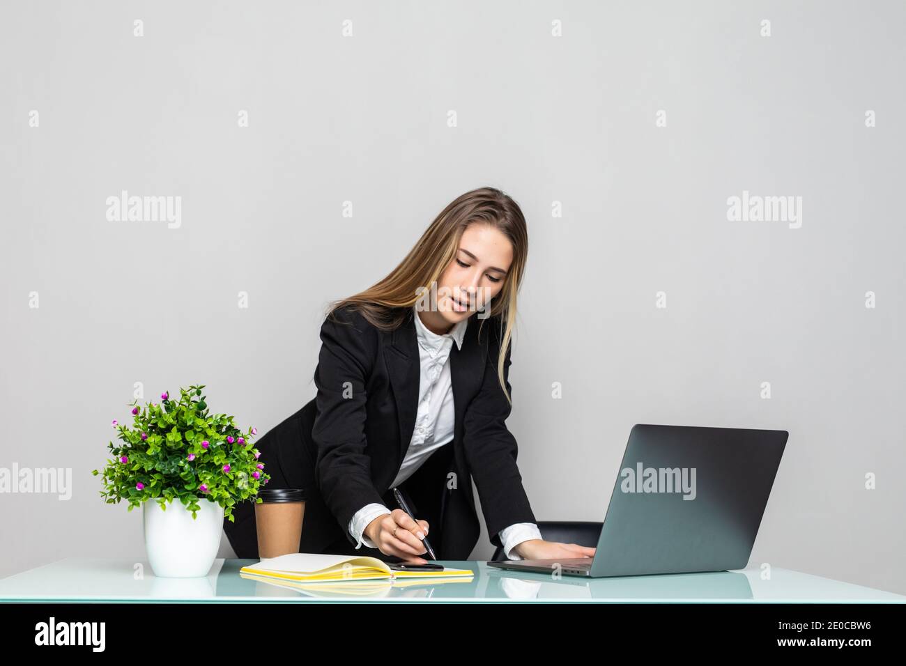 Young Woman Leaning Over Desk High Resolution Stock Photography and ...