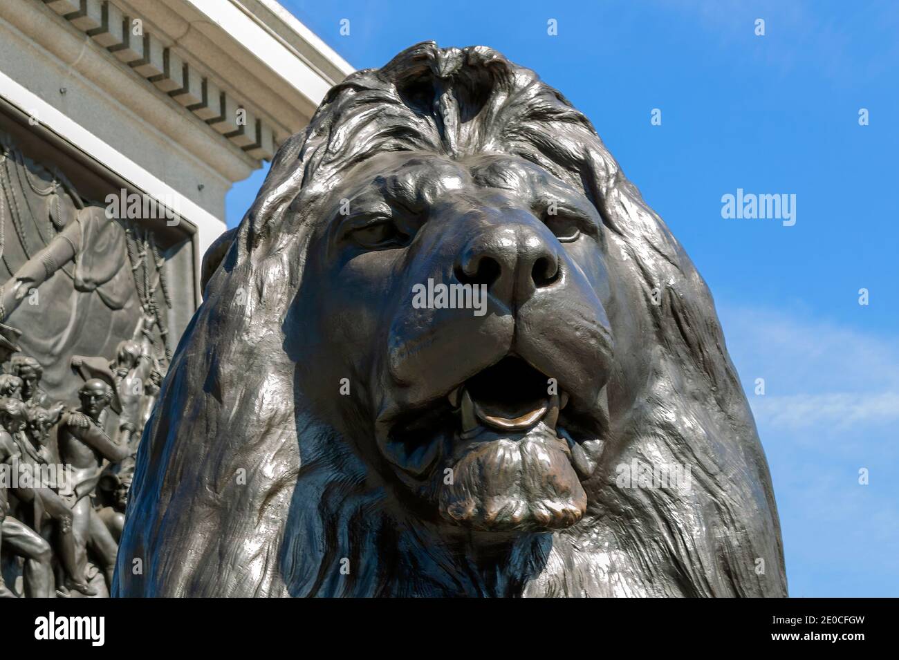 Trafalgar Square lion statue at the base of Nelson’s Column in London ...