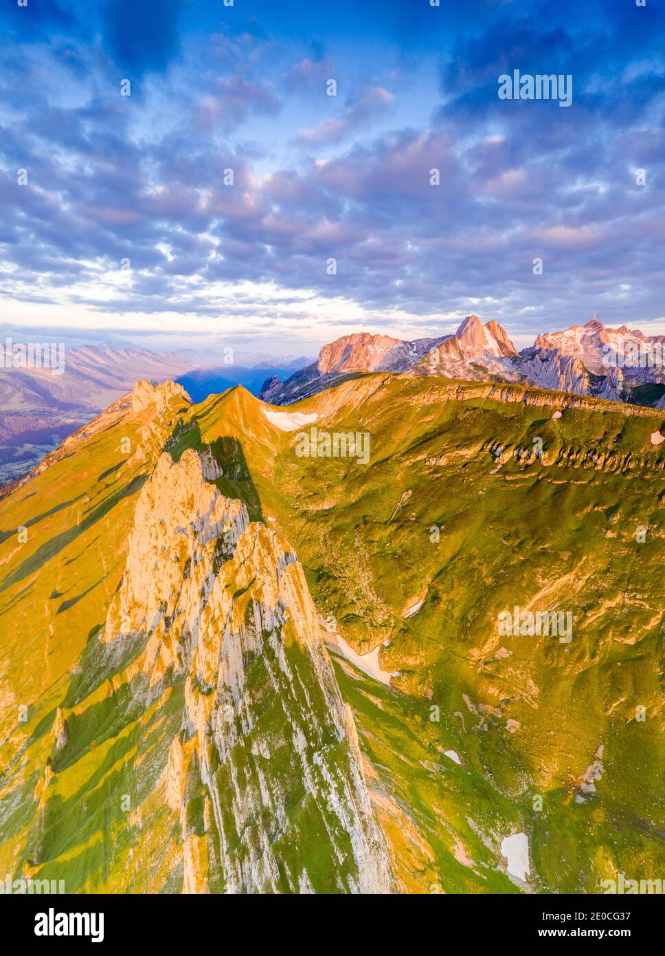 Clouds at dawn over the majestic peaks of Santis and Saxer Lucke ...