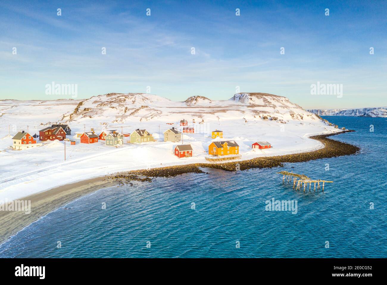 Aerial view of the fishing village of Veines in winter, Kongsfjord ...