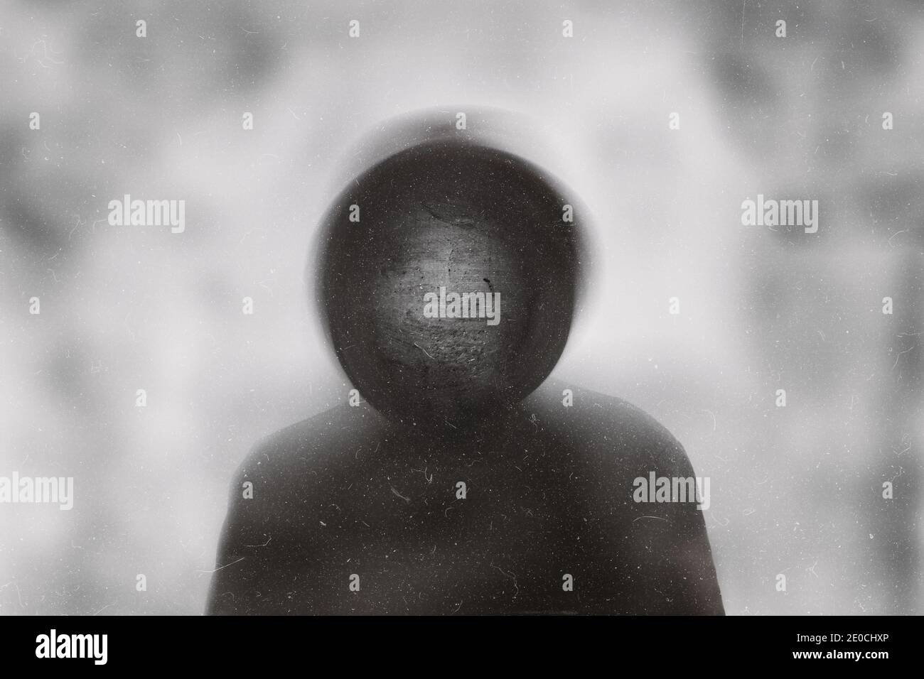 A scary hooded figure with no face looking at the camera. With a ...
