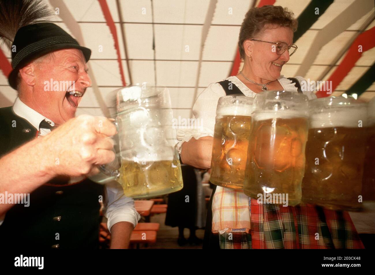 Germany /Bavaria /Munich/ waitressr serving beers in tent at ...