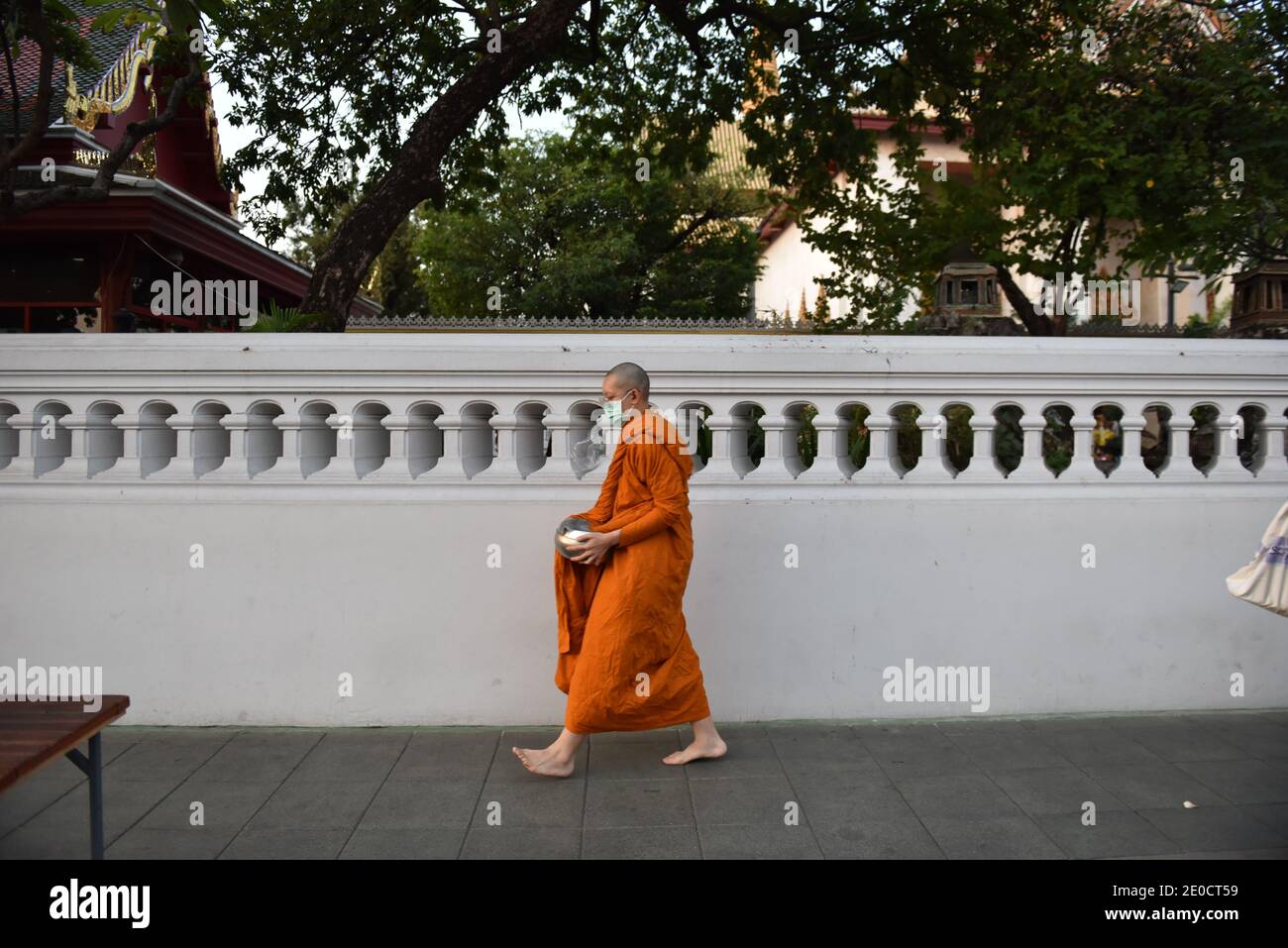 Bangkok, Thailand. 31st Dec, 2020. Bangkok : Monks leaving the temple ...