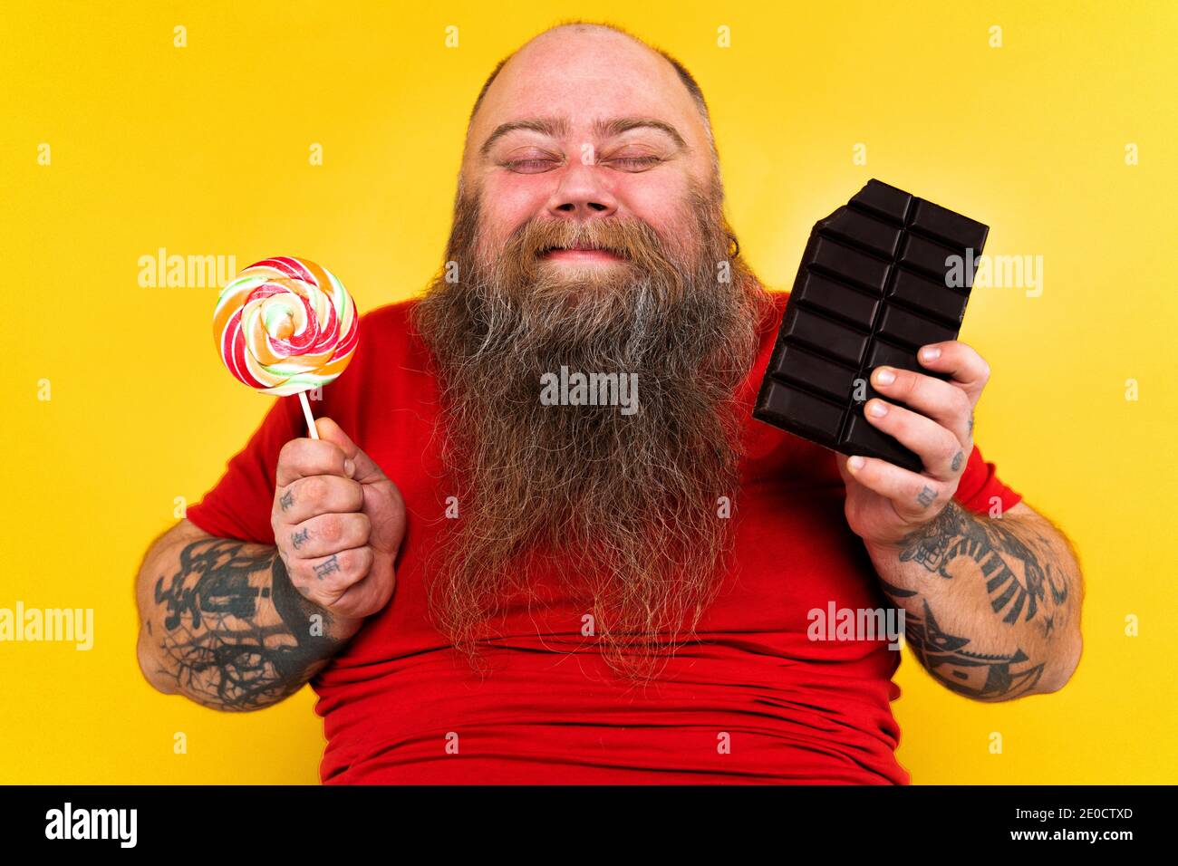 Funny and hilarious fat man hungry for unhealthy food Stock Photo - Alamy