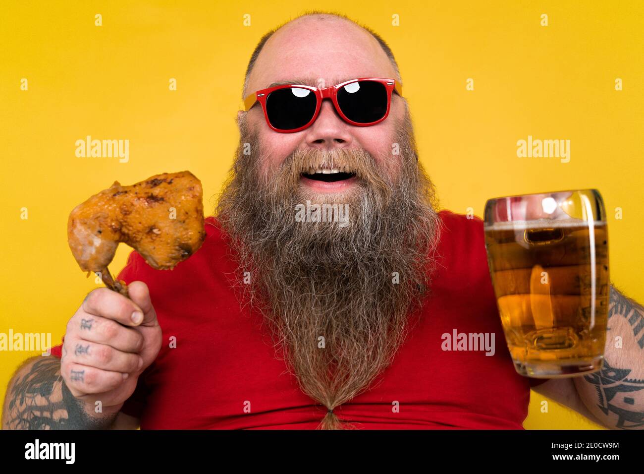 Funny and hilarious fat man hungry for unhealthy food Stock Photo - Alamy