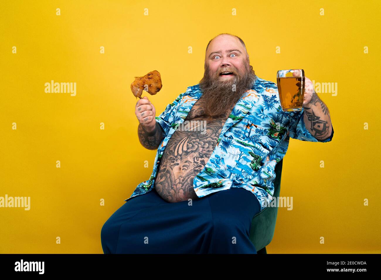 Funny and hilarious fat man hungry for unhealthy food Stock Photo - Alamy