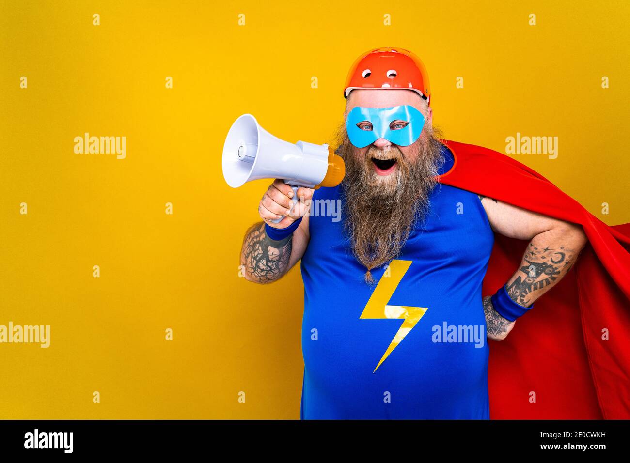 Funny fat man with superhero costume acting as superhuman with special ...