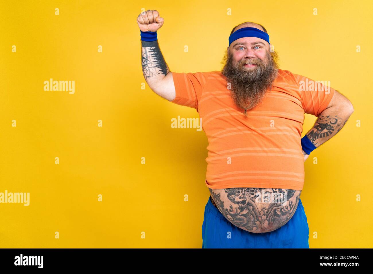 Funny fat man doing some sport exercises - Overweight man having weight ...