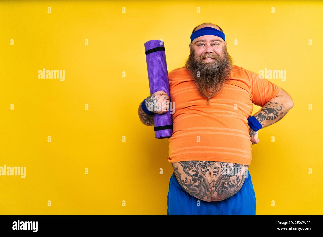 Funny fat man doing some sport exercises - Overweight man having weight ...