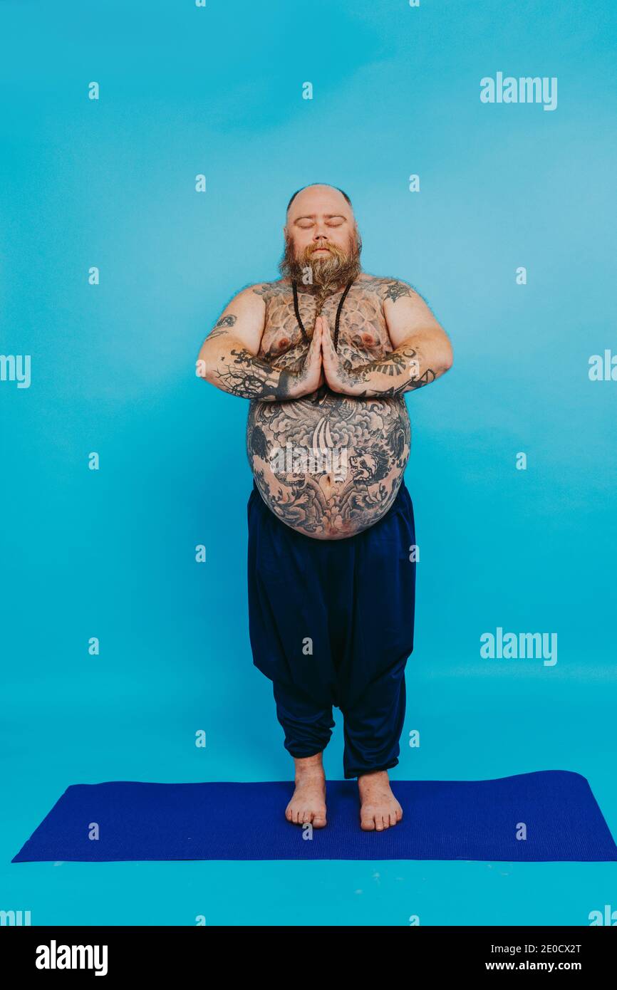 Funny fat man doing yoga meditation, funny and ironic character Stock ...