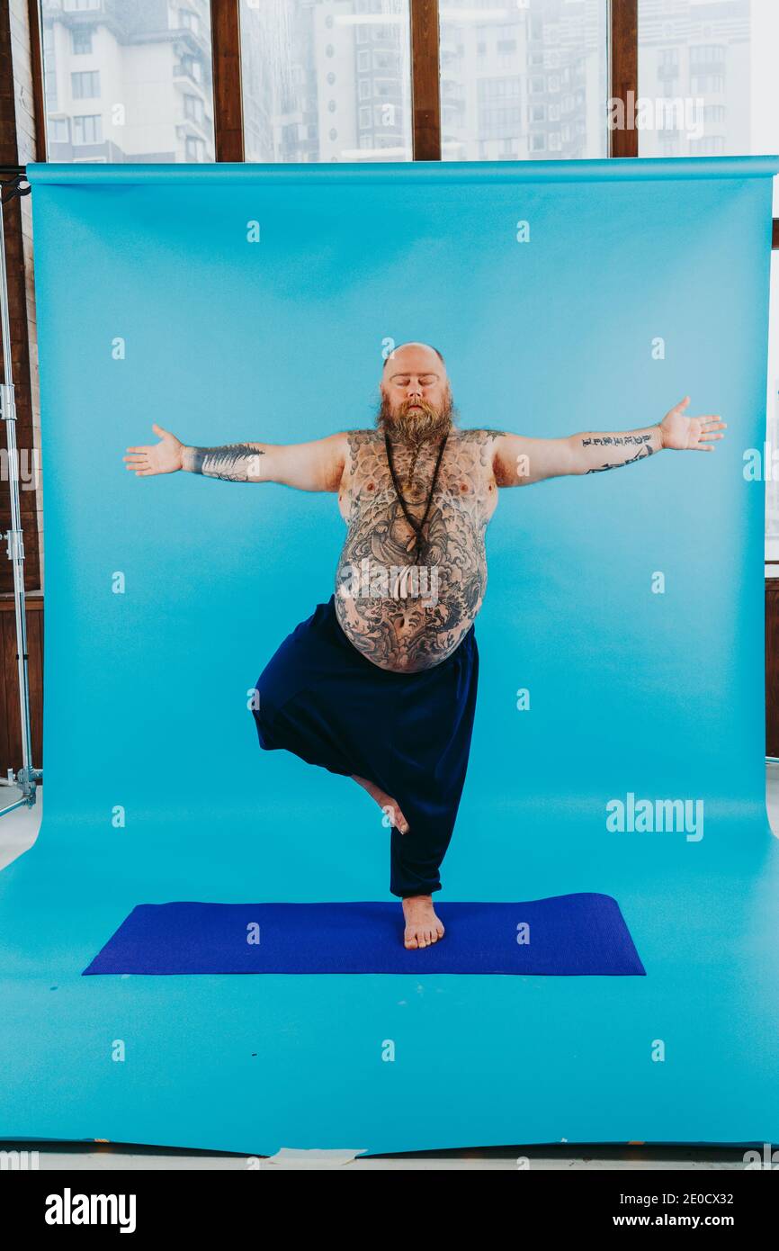 Funny fat man doing yoga meditation, funny and ironic character Stock ...