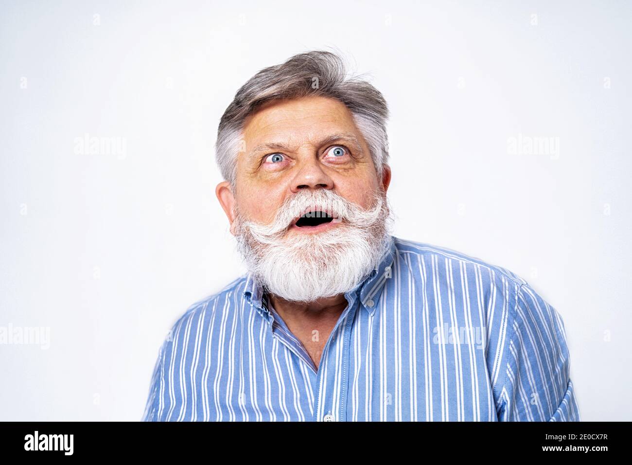 Eccentric senior man with funny expression portrait on background ...