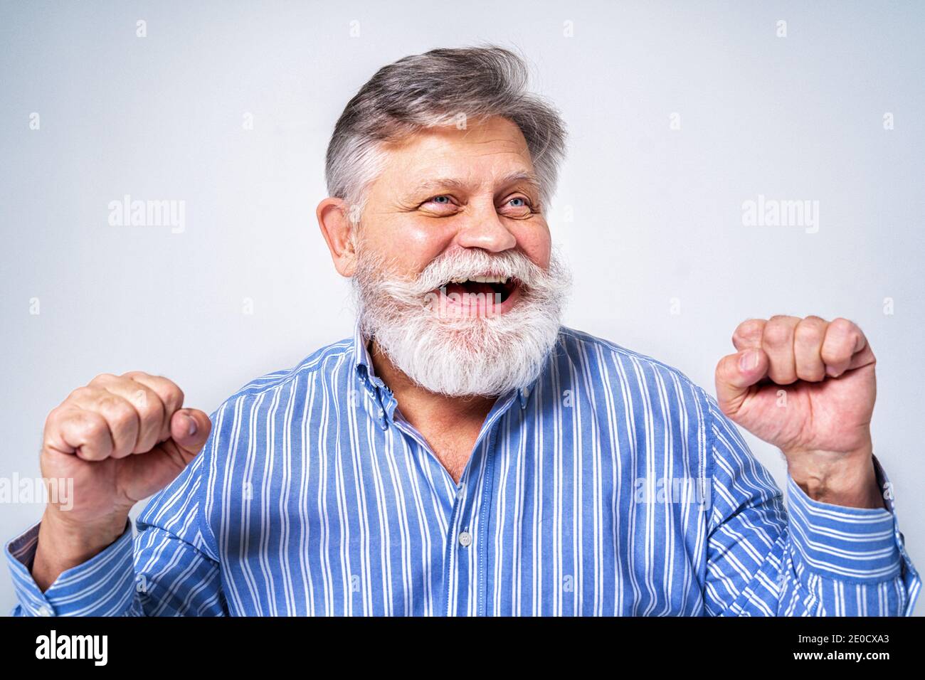 Eccentric senior man with funny expression portrait on background ...