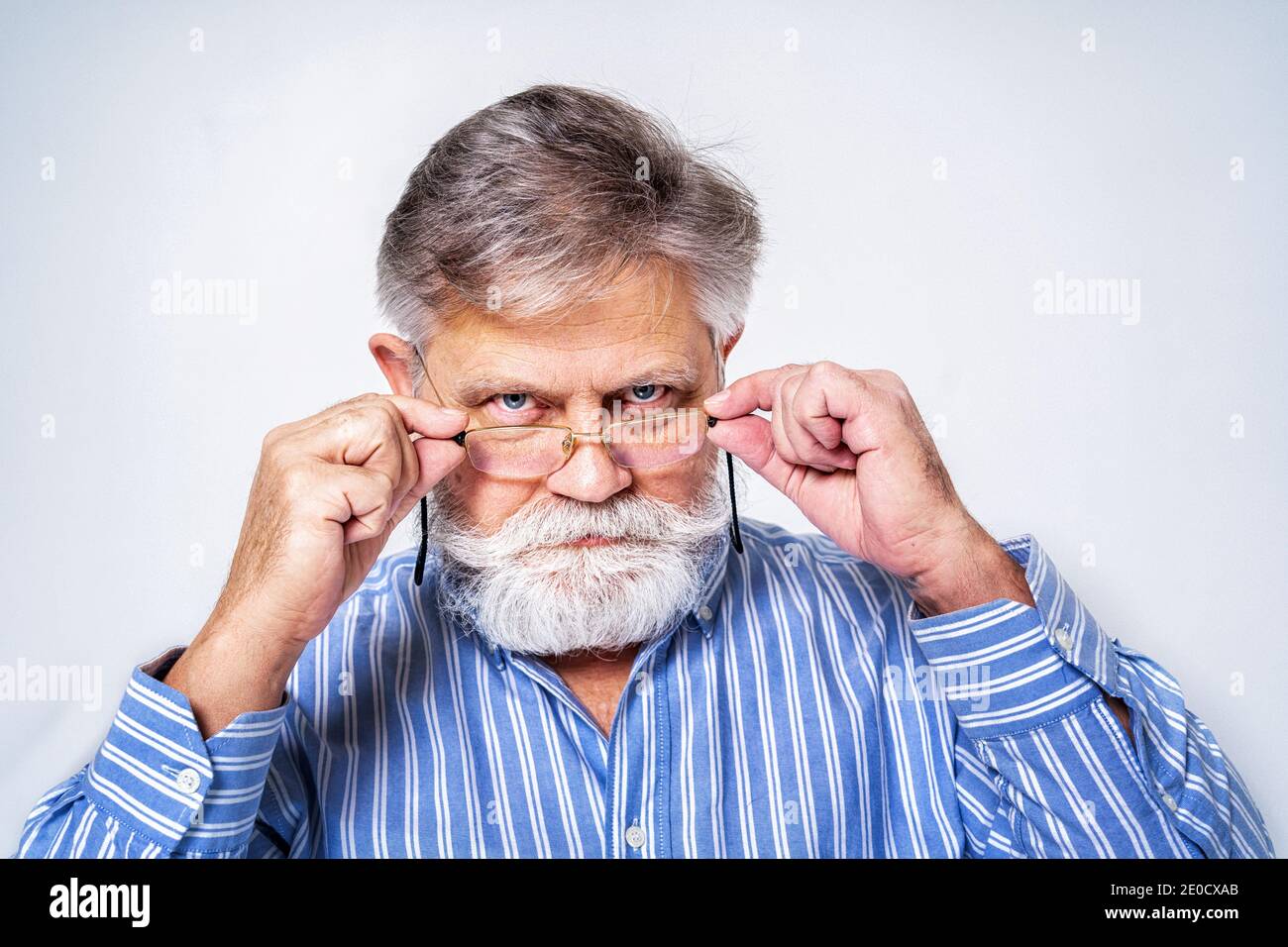Eccentric senior man with funny expression portrait on background ...