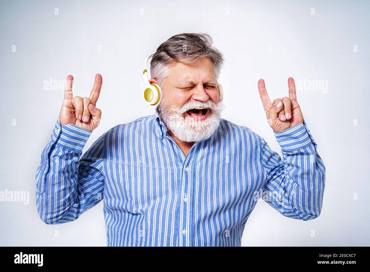 Eccentric senior man with funny expression portrait on background ...