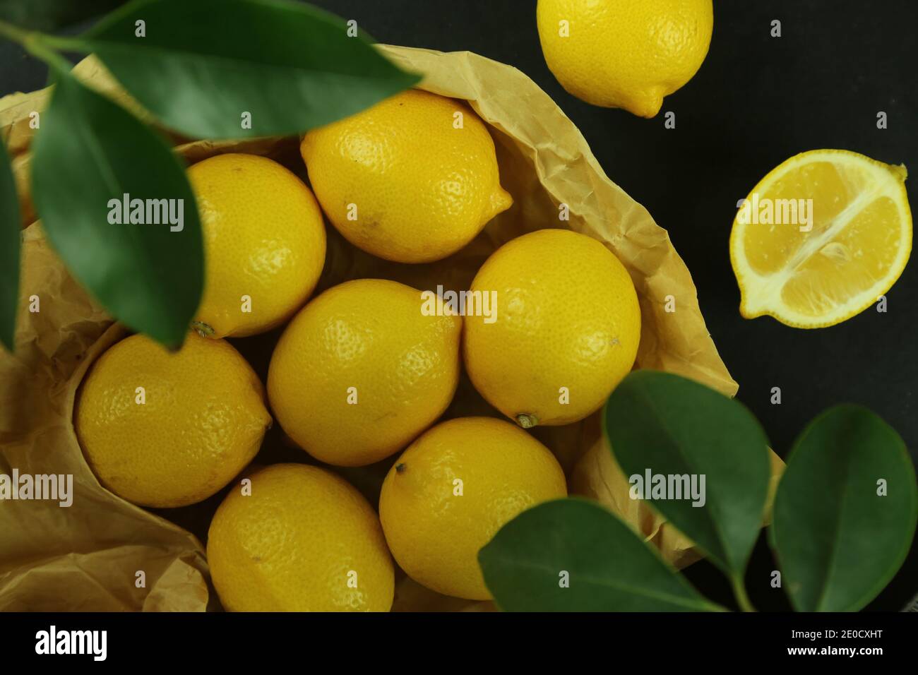Group of lemons with leaves, isolated on background Stock Photo - Alamy