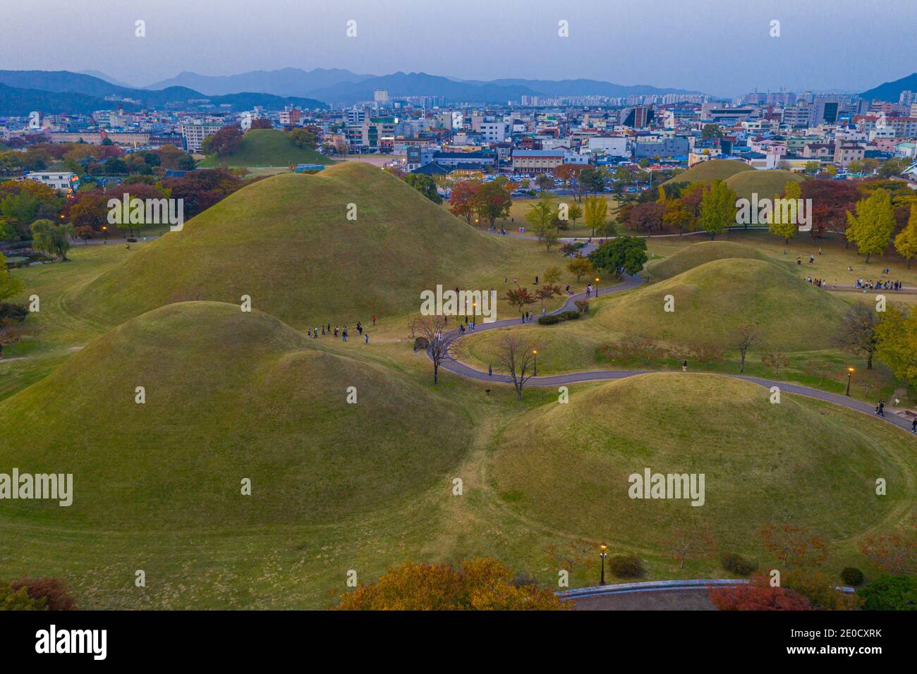 Sunset aerial view of Tumuli park containing several royal tombs in ...