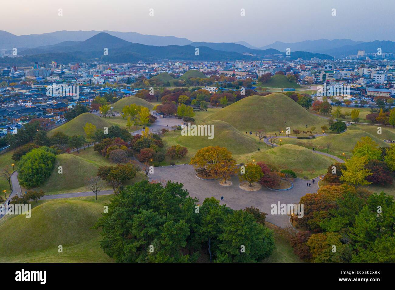 Sunset aerial view of Tumuli park containing several royal tombs in ...