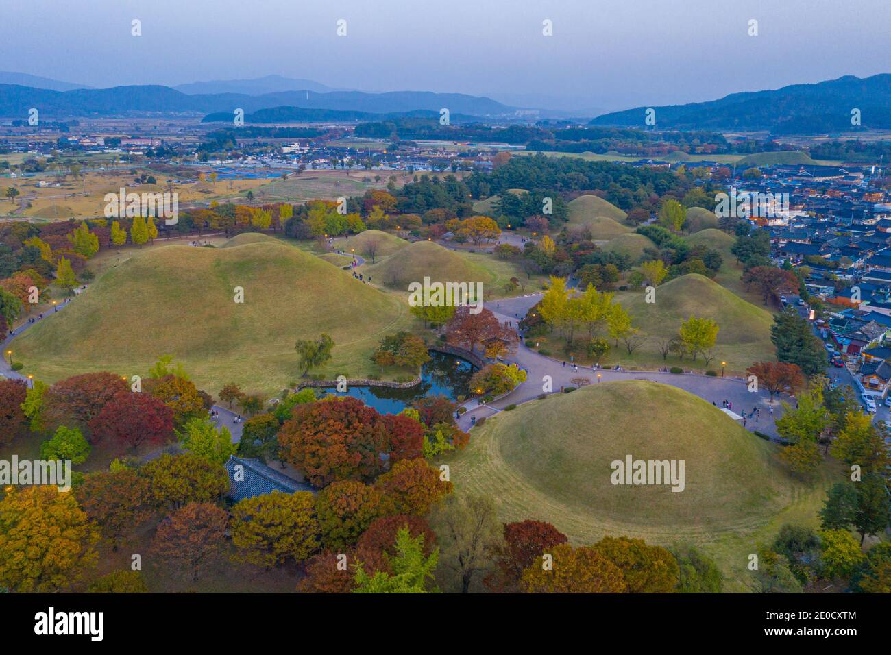 Sunset aerial view of Tumuli park containing several royal tombs in ...