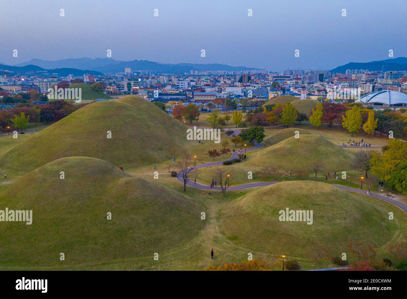 Sunset aerial view of Tumuli park containing several royal tombs in ...