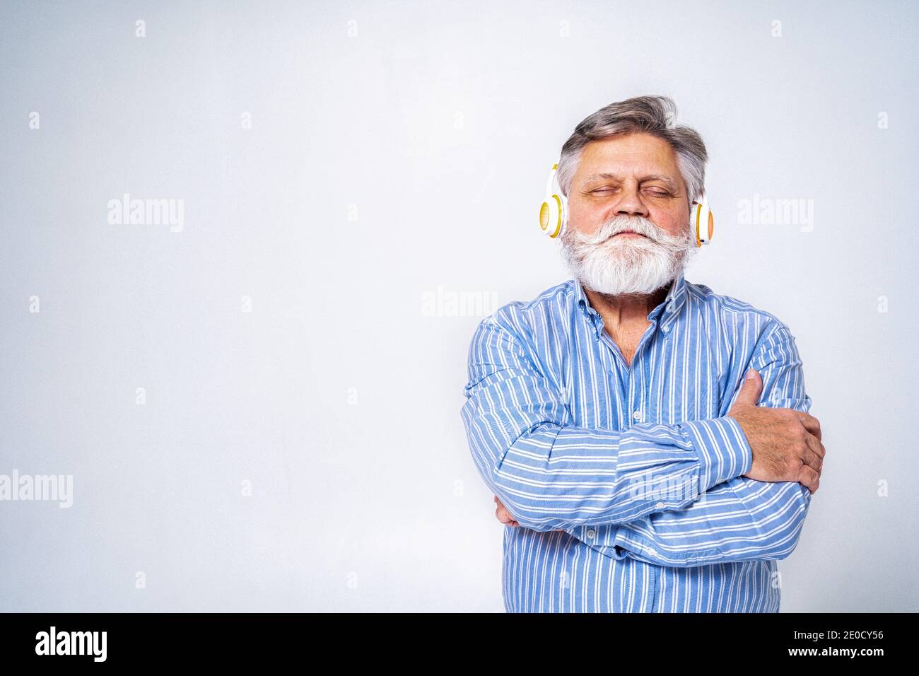 Eccentric senior man with funny expression portrait on background ...
