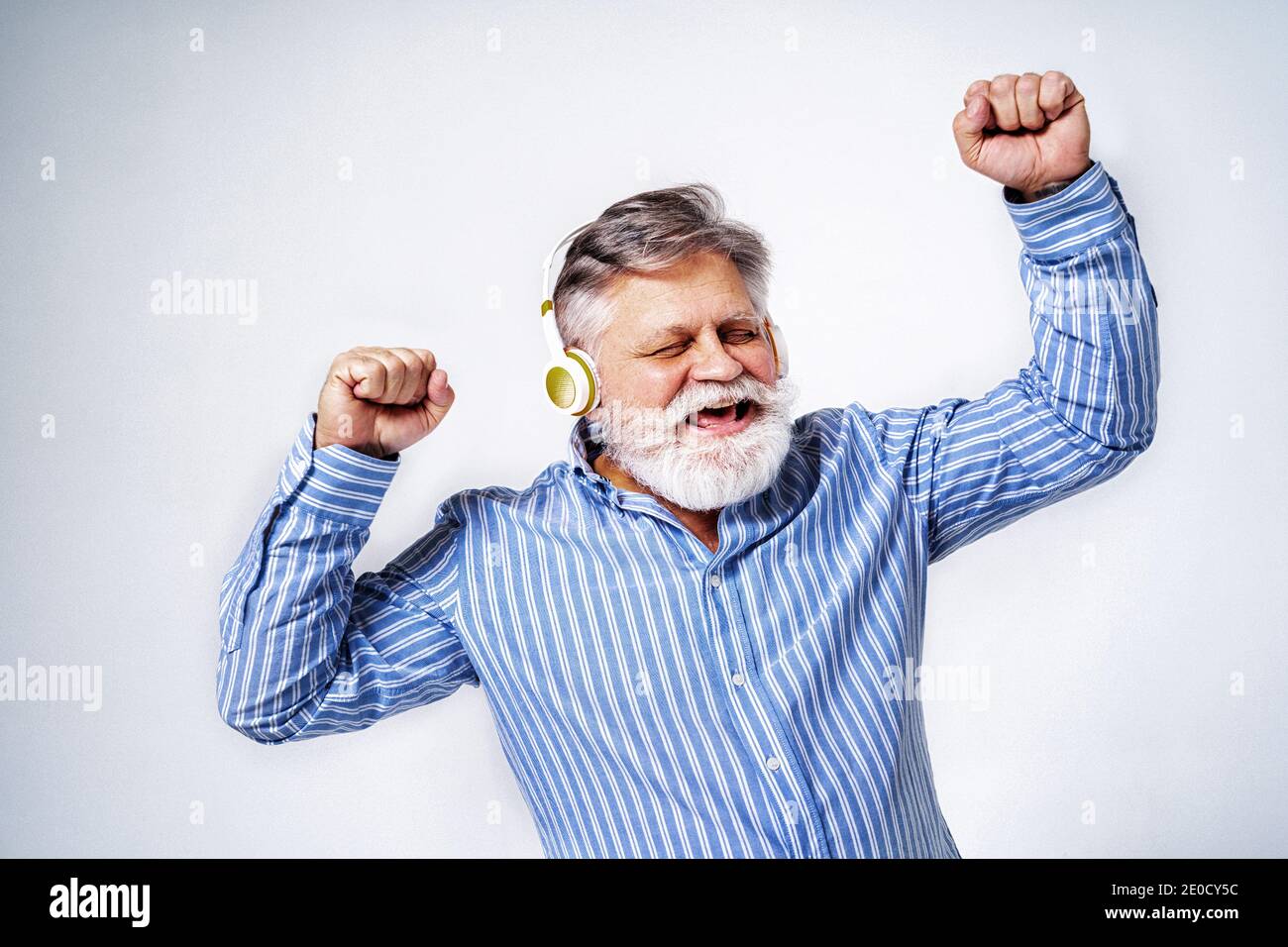 Eccentric senior man with funny expression portrait on background ...