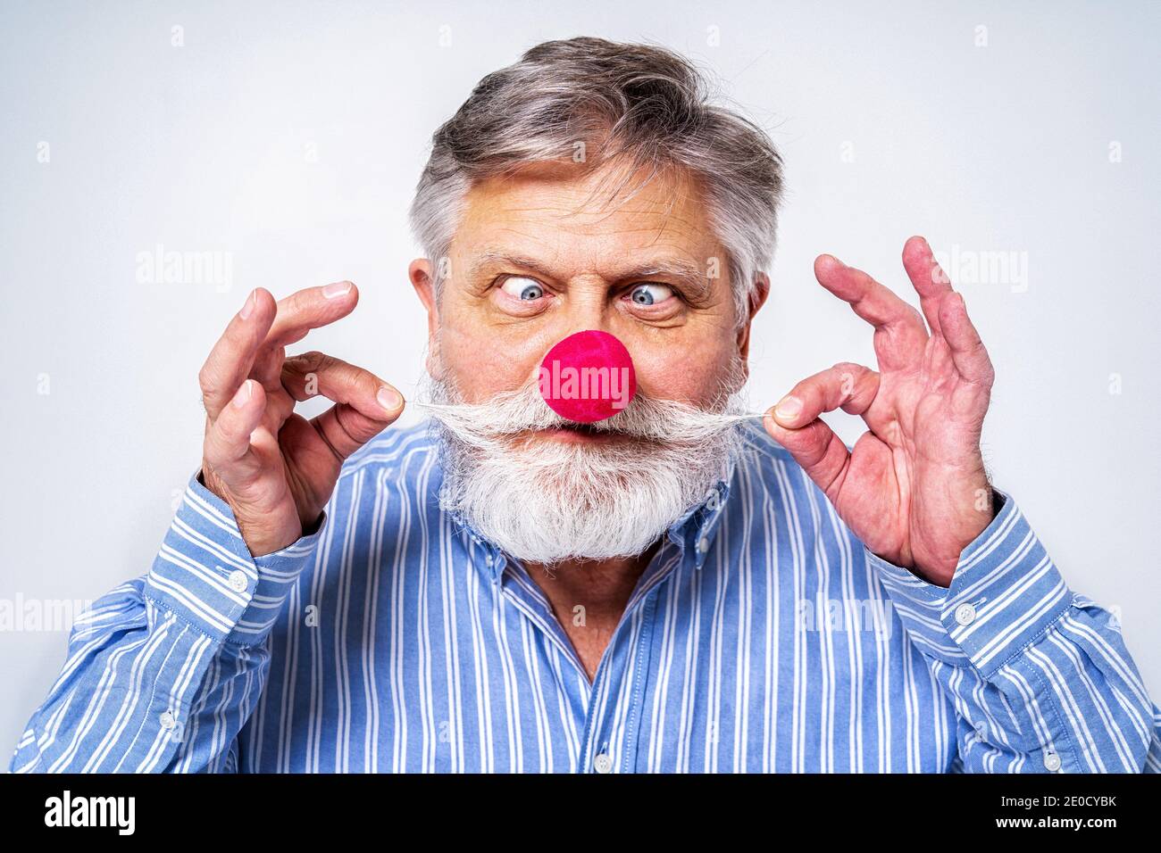 Eccentric senior man with funny expression portrait on background ...