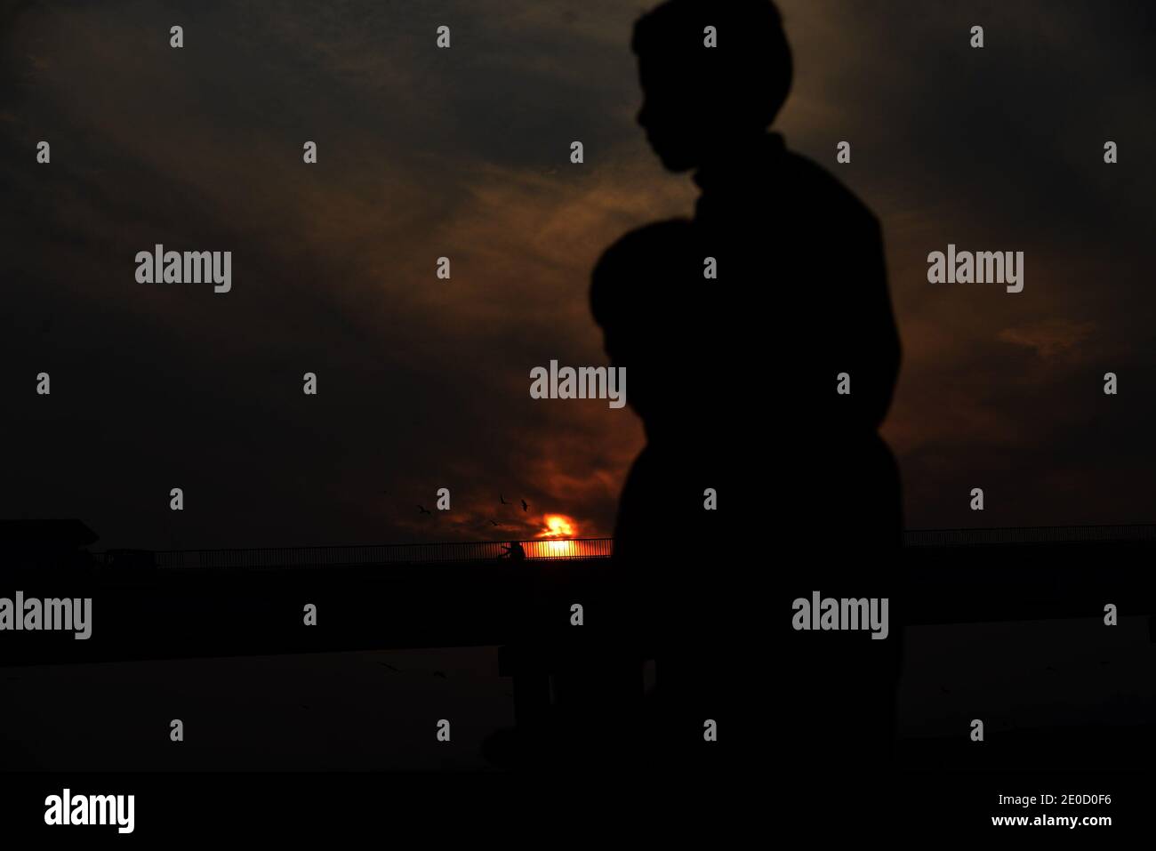 Pakistani people busy in their routine work during last sunset of the ...